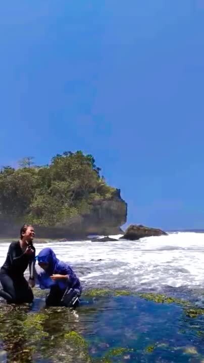 Two Friends Get Knocked Over as Waves Hit Them at Beach in Indonesia ...