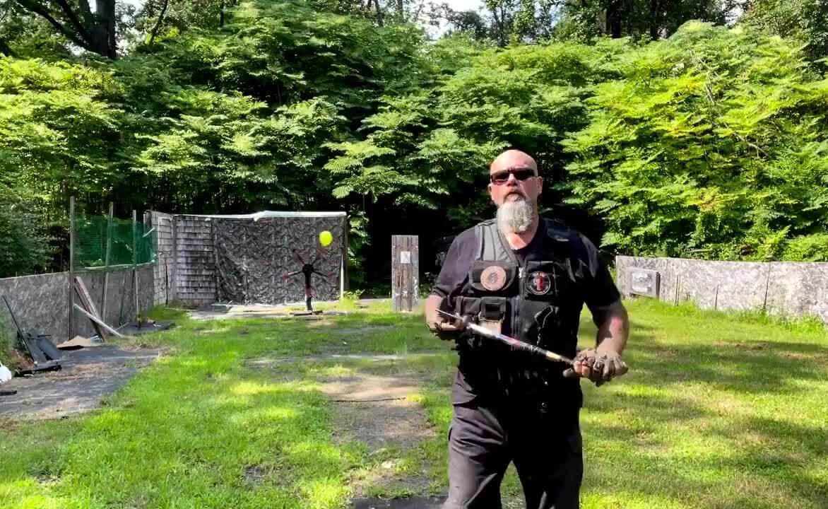 Man Throws Axe and Strikes Balloon Stuck on Spinning Fan | Jukin Licensing