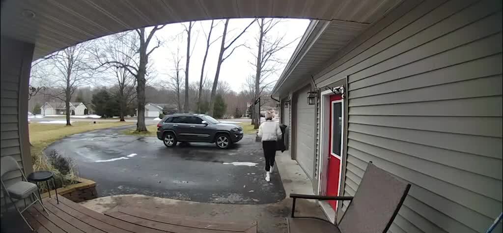 Girl Headed Outside Loses Footing and Drops Thermos | Jukin Licensing