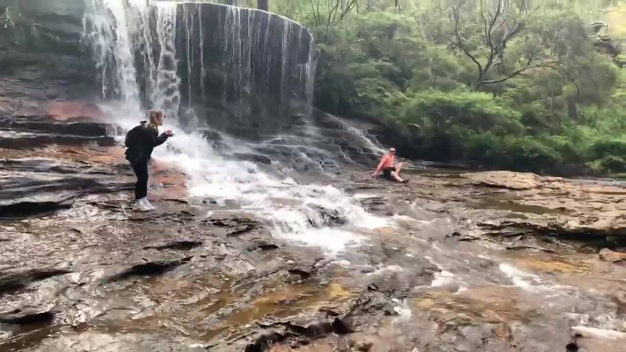 Woman Visiting Waterfall Loses Footings and Falls | Jukin Licensing