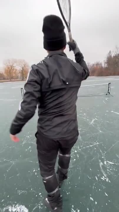 Two People Play Tennis While Skating on Ice | Jukin Licensing
