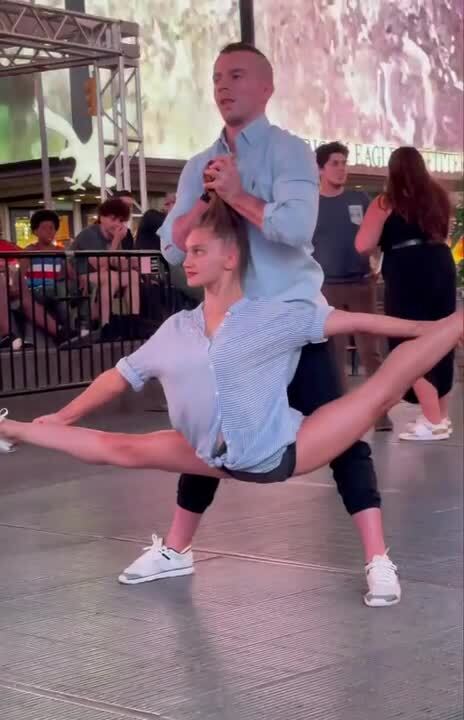 Guy Lifts Girl By Hair While She Does Full Split | Jukin Licensing