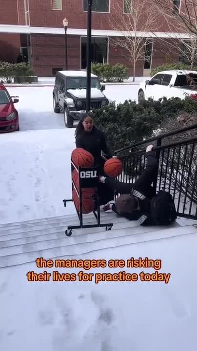 Man Helping Woman Carry Rack Loses Footing and Falls on Icy Stairs in ...