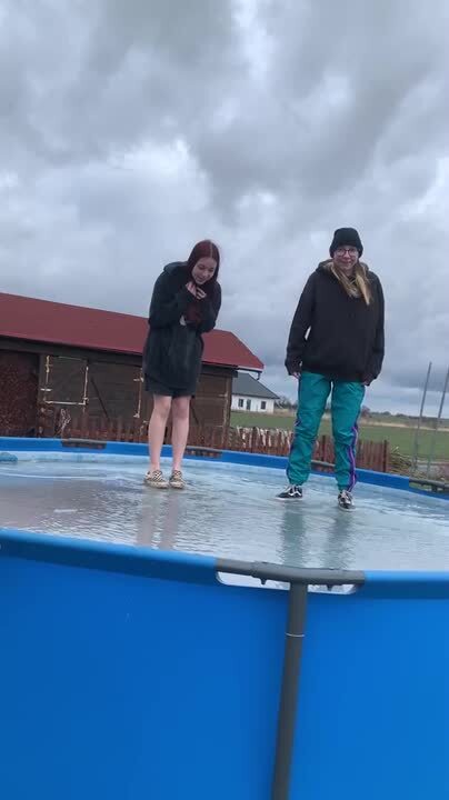 Girls Fall Into Frozen Pool When One of Them Jumps on Ice | Jukin Licensing