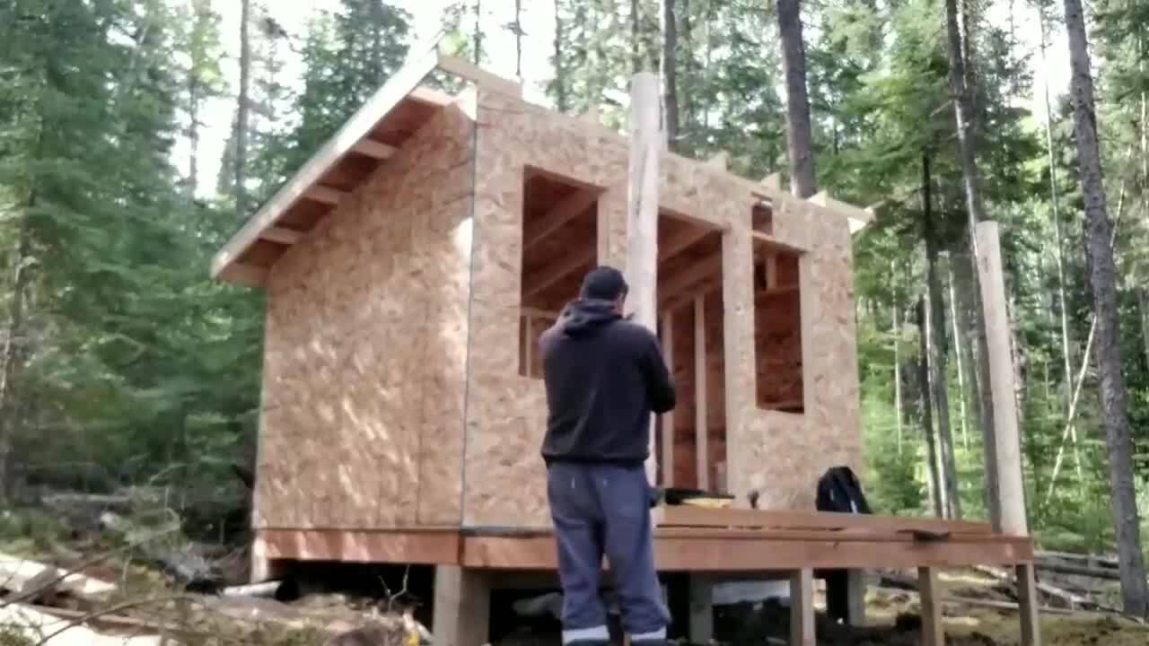 Man Builds DIY Off-Grid Cabin by Lake | Jukin Licensing