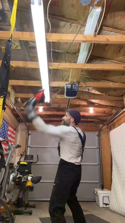Man Breaks Ceiling Light During Boxing Practice in Garage | Jukin Licensing