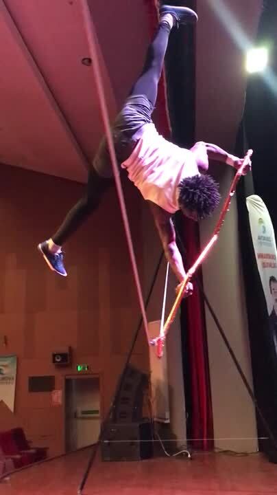 Circus Artist Balances His Body Upside Down on Slackline Using Stick ...