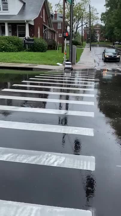 Delivery Robot Gets Struck by Turning Car While Crossing Road | Jukin ...