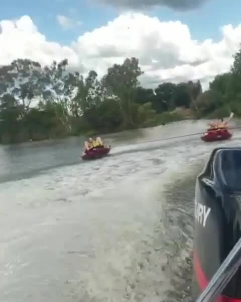 Boys Riding Inflated Boats for Water Sports Fail and Fall in River ...