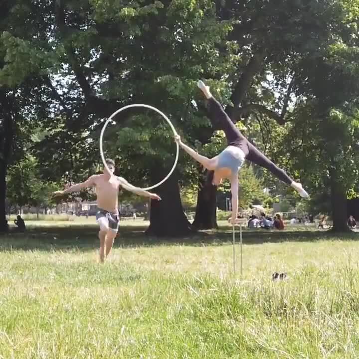 Duo of Gymnasts Display Remarkable Hula Hoop Trick | Jukin Licensing