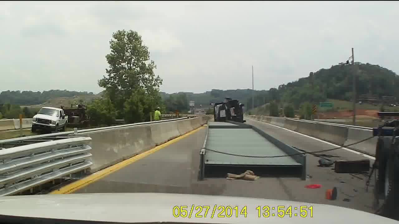 Truck Carrying Support Beam Tips Over on Highway | Jukin Licensing