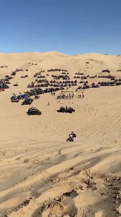 Guy Falls Off Dirt Bike After Attempting Jump Off Dune | Jukin Licensing