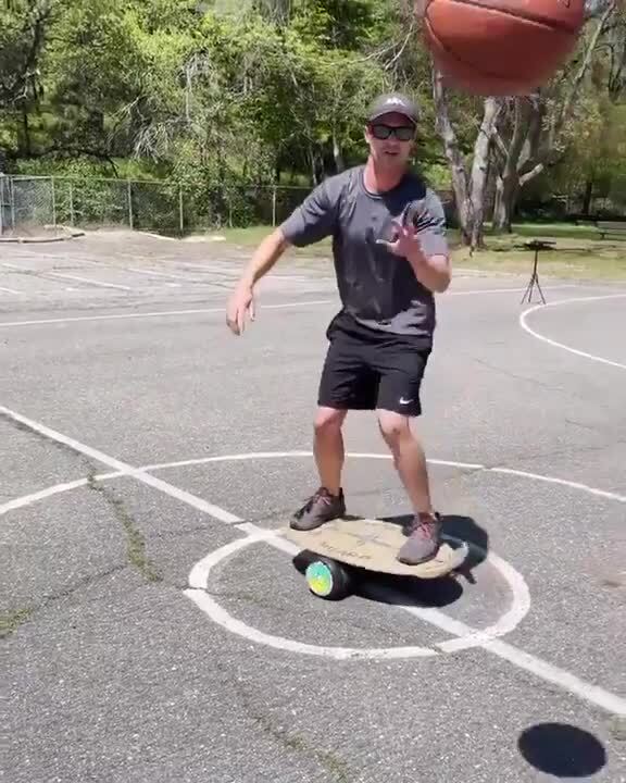 Man Makes Two Half-Court Basketball Shots While Balancing on Balance ...