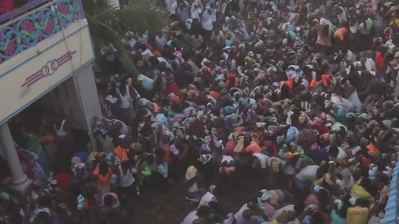 Crowd of People Gather to Perform Ritual of Throwing Cow Dung Cakes at ...