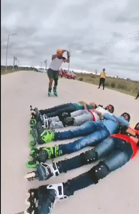 Guy Wearing Rollerblades Performs Superb Skating Trick by Jumping Over ...