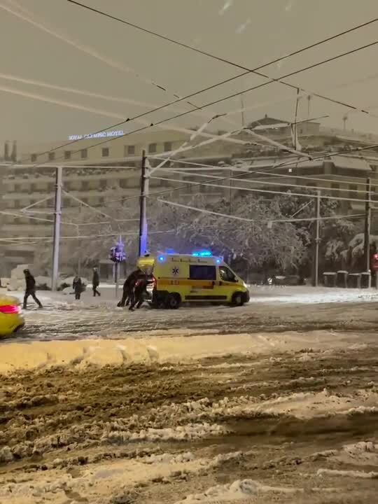 Group of People Push Ambulance Out of Snow | Jukin Licensing