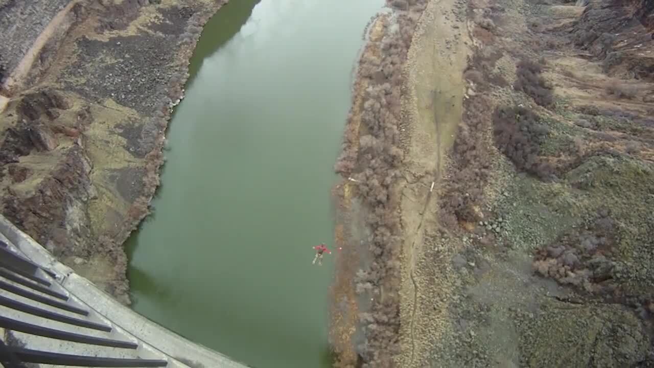 BASE Jump Off Bridge to River Below | Jukin Licensing
