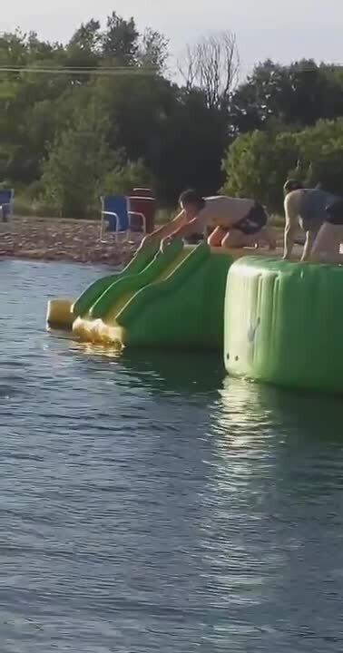 Man Tries To Go Down Kiddie Slide Into Water but Fails | Jukin Licensing