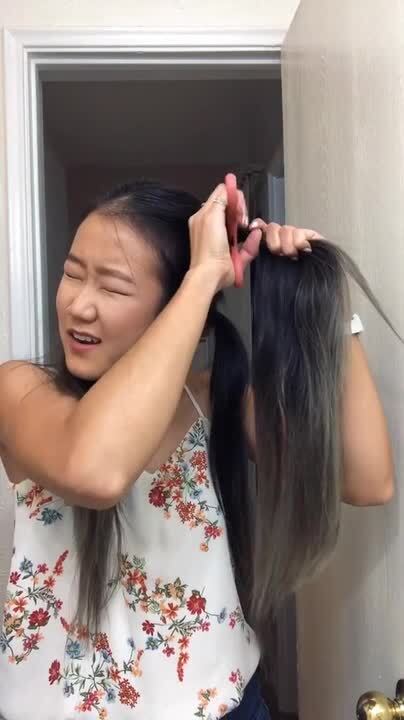 Girl Breaks Scissors While Trying to Cut Her Ponytail | Jukin Licensing