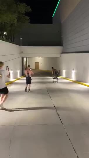 Two Shirtless Guys Riding Trolley Down Slope Hit Wall | Jukin Licensing