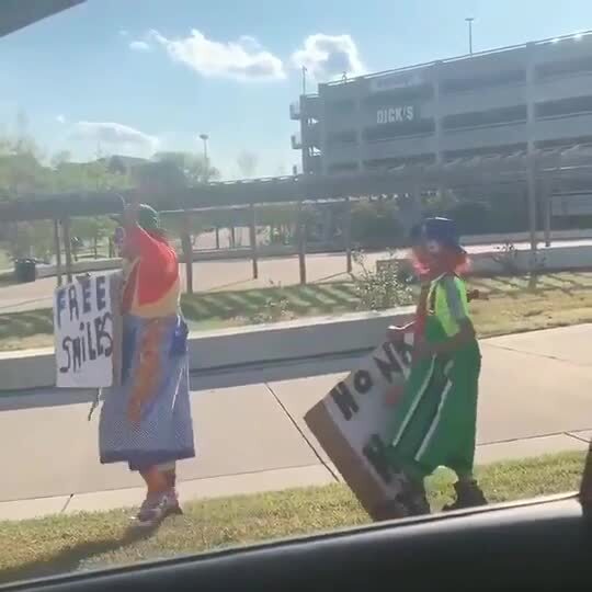 Father and Son Dressed as Clowns Entertain Passerby Amidst Coronavirus ...