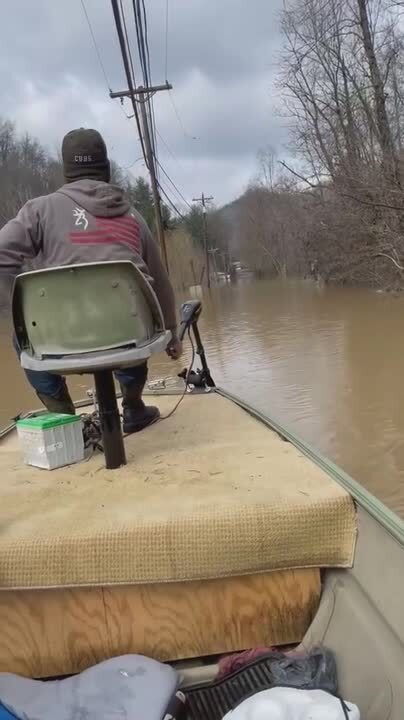 Guy Takes Boat Ride Across Flooded Neighborhood | Jukin Licensing