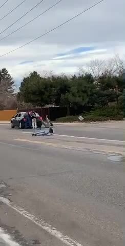 Skateboarders Fall to Road While Car Skitching | Jukin Licensing