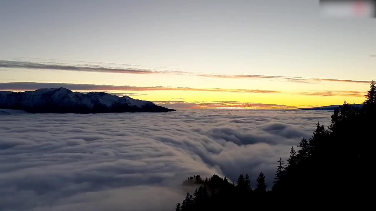 Clouds Roll Over Postăvarul Peak In Romania During Sunset | Jukin Licensing
