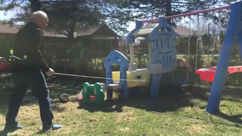 Grandpa Operates Toddler On Swing With Rope Responsible Practicing ...