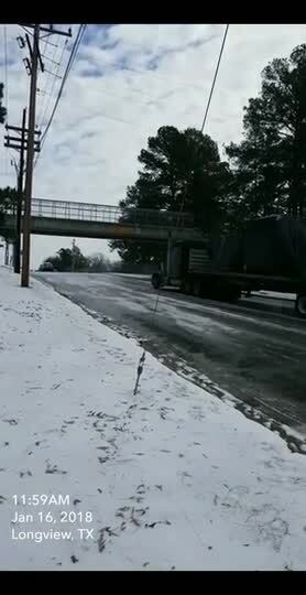 Semi Truck Crashes After Sliding Backwards Down Icy Road | Jukin Licensing