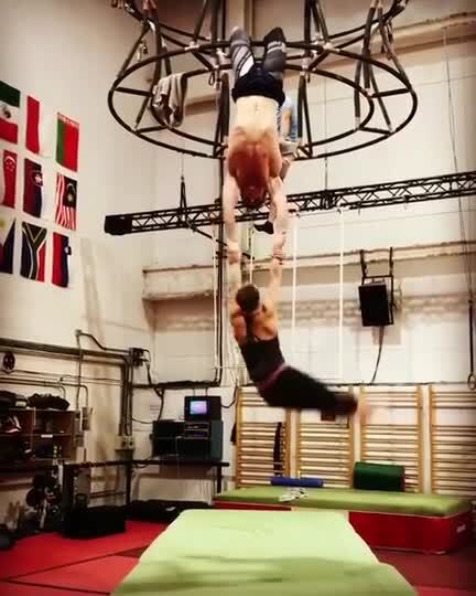Acrobatic Duo Perform Tricks on Trapeze | Jukin Licensing