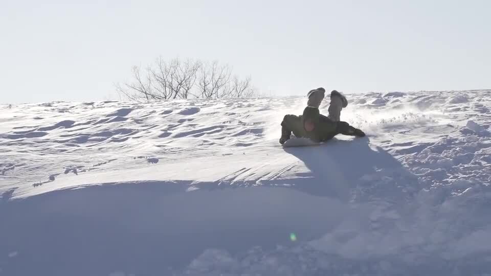 Guy Crashes Into Ice While Sliding on Snow Boogie Board | Jukin Licensing