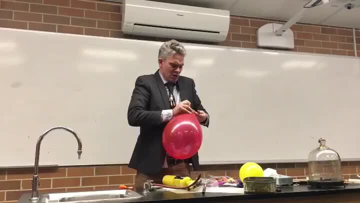 Teacher Demonstrates Danger of Helium Replacement Gas in Party Balloons ...