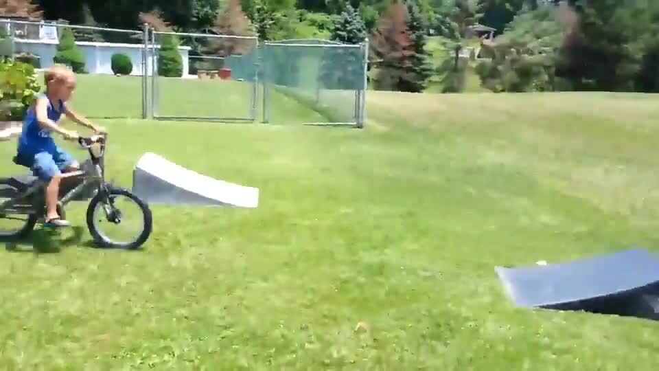 Kid Faceplants on Backyard Bike Jump | Jukin Licensing