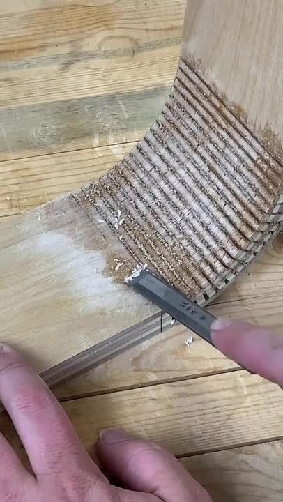 Person Shows Sanding Trick Over Curved Wooden Board | Jukin Licensing