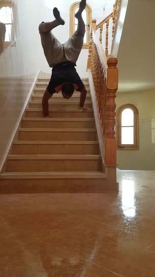 Guy Falls Face-First Trying to Walk Down Staircase While Doing ...