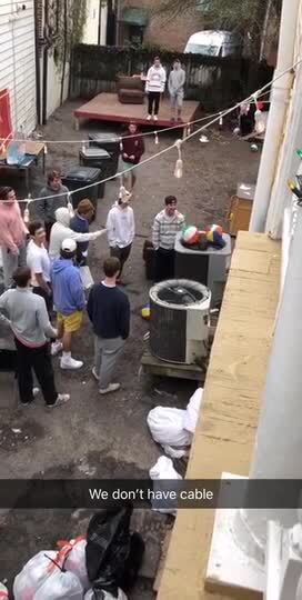 Guys Watch Two Inflatable Balls Fight Each Other On Top Of Air Vent ...