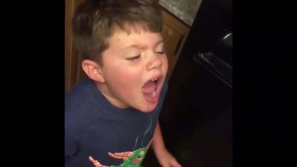 Father Uses Football to Remove Son's Loose Tooth | Jukin Licensing