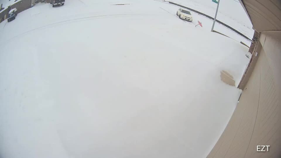 Vehicles Slip and Slide on Snowy Road Hitting Stop Sign Board One After ...