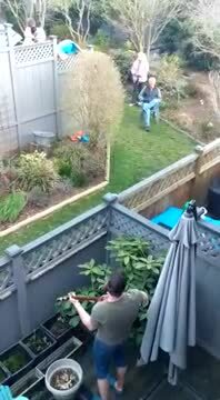Neighbors Join in While Maintaining Social Distance as Man Holds Patio ...