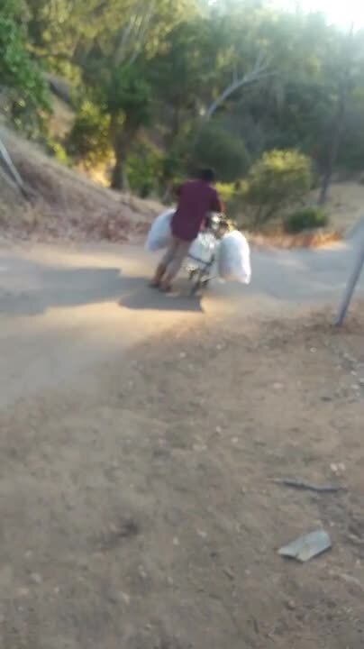 Homeless Man Rides Cart to Collect Cans | Jukin Licensing