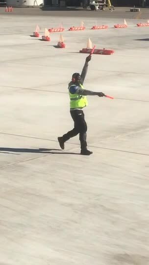 Ground Controller Dances While Directing Plane on Runway | Jukin Licensing
