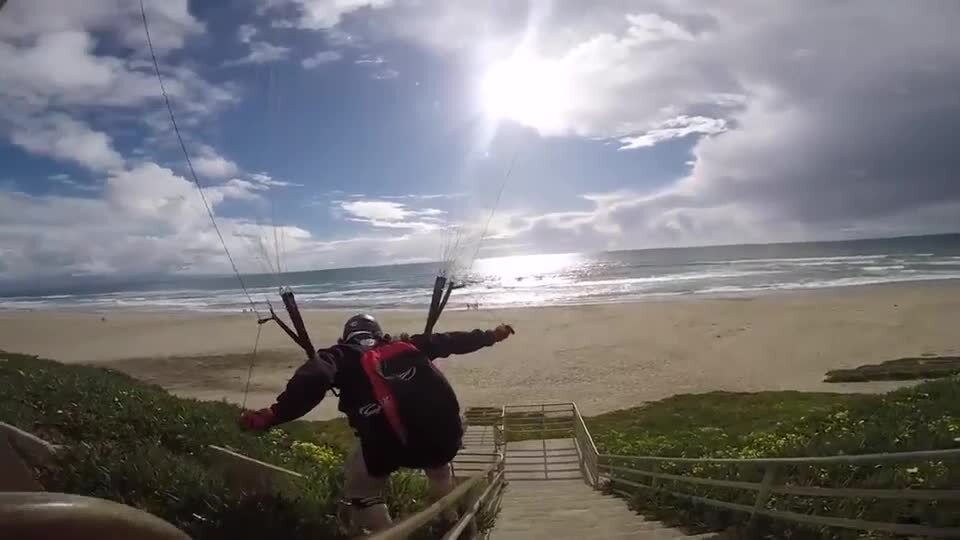 Guy Performs Sweet Paragliding Tricks on Rails | Jukin Licensing