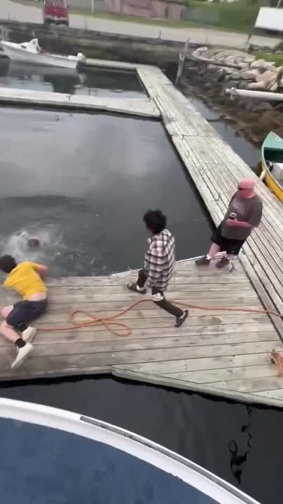 Guy Awkwardly Falls While Jumping Off Boat | Jukin Licensing