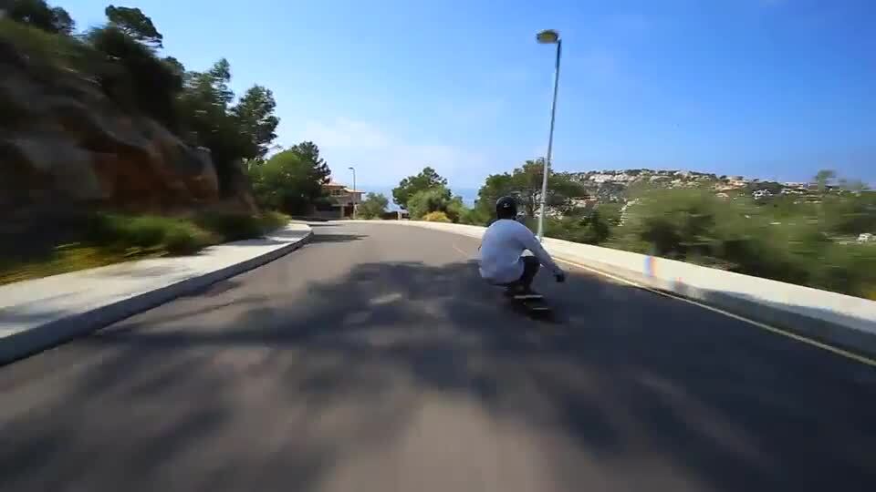 Guy Longboards Through Scenic Neighborhood | Jukin Licensing