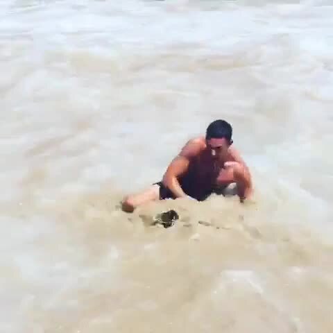 Guy Knocked Down by Wave | Jukin Licensing