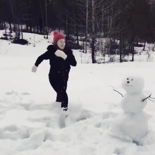 Girl Falls While Trying to Kick Snowman | Jukin Licensing