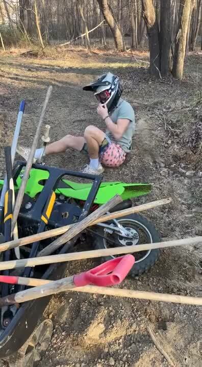 Person Riding Mini Bike Loses Balance at Curve and Falls | Jukin Licensing