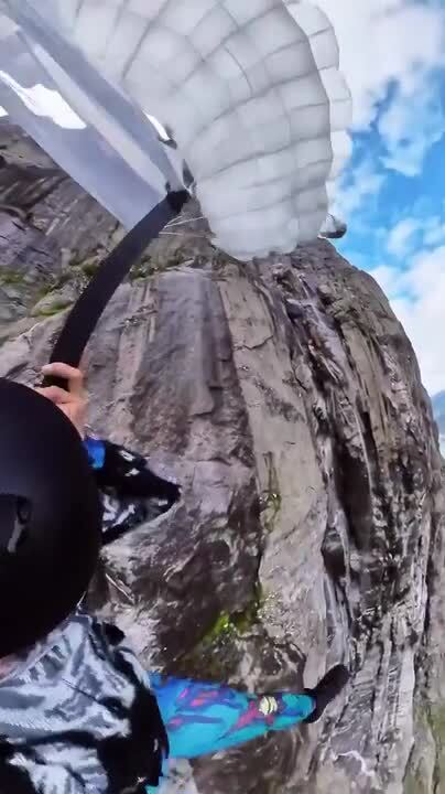 Guy Does BASE Jumping Off Cliff And Makes Smooth Landing on Rocky ...