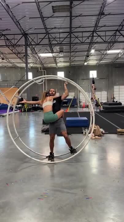 Couple Attempts Cartwheel Form on German Wheel Apparatus | Jukin Licensing